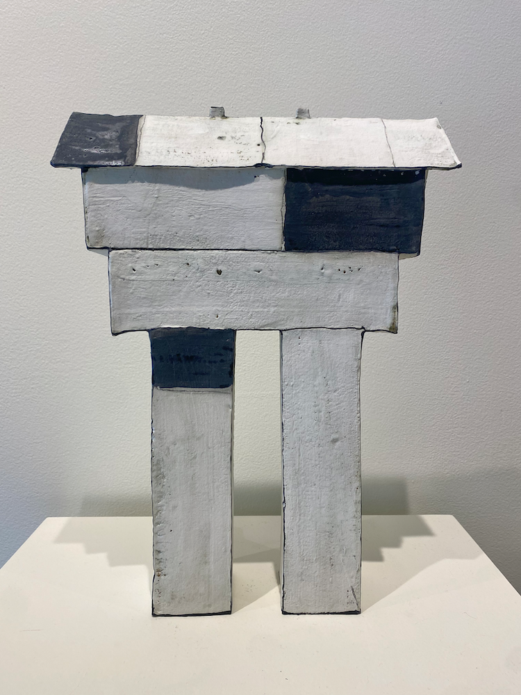 Tall house structure on two legs with black roof detail | Mary Fischer ...